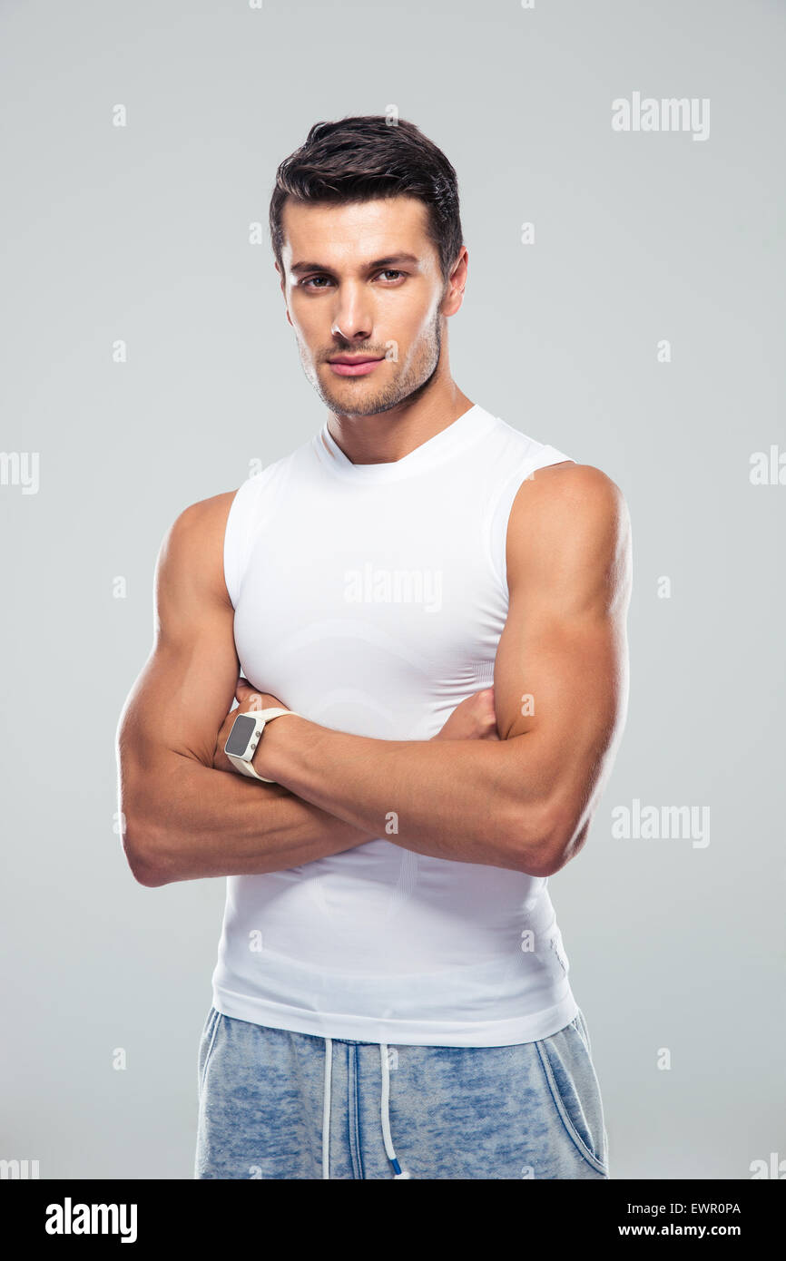 Serious muscular man arms folded hi-res stock photography and images ...