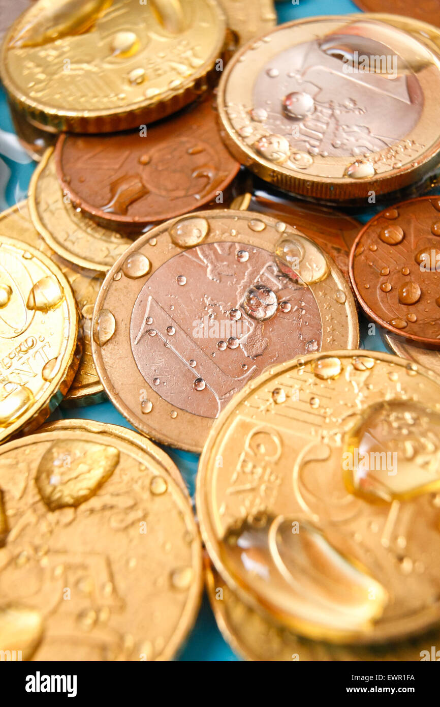Water price concept with euro currency coins and water drops, vertical ...