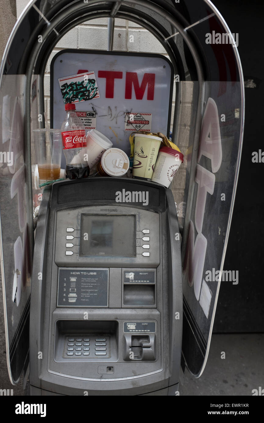 An ATM on Manhattan that has died and is buried in rubbish Stock Photo ...