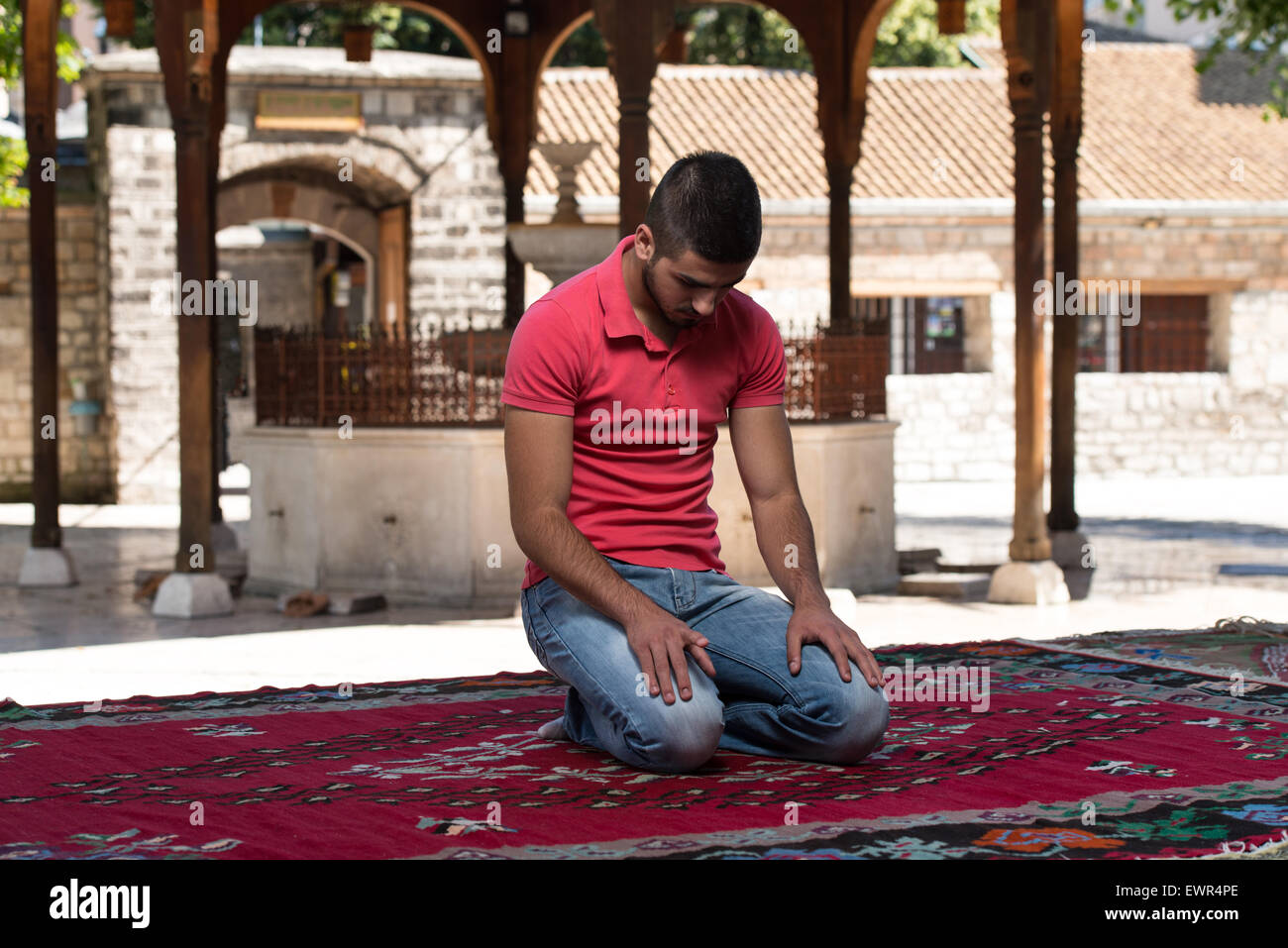 Muslim Man Is Praying In The Mosque Outdoors Stock Photo - Alamy