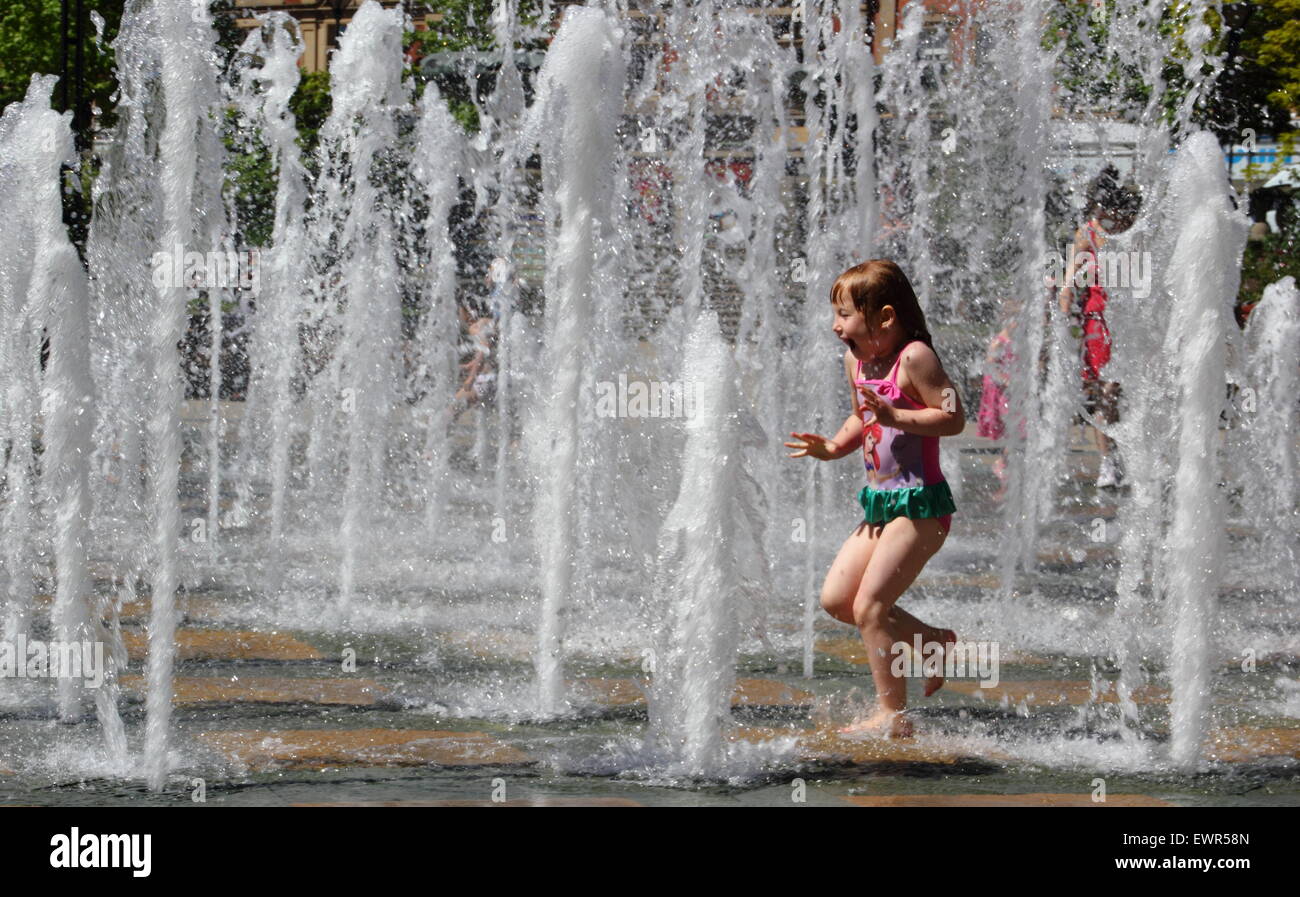 Girl playing in water jets hi-res stock photography and images - Alamy