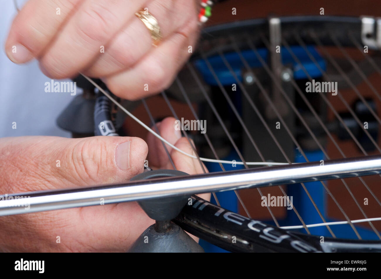 Tennis Racket in Stringing Machine Being Repaired Stock Photo - Alamy
