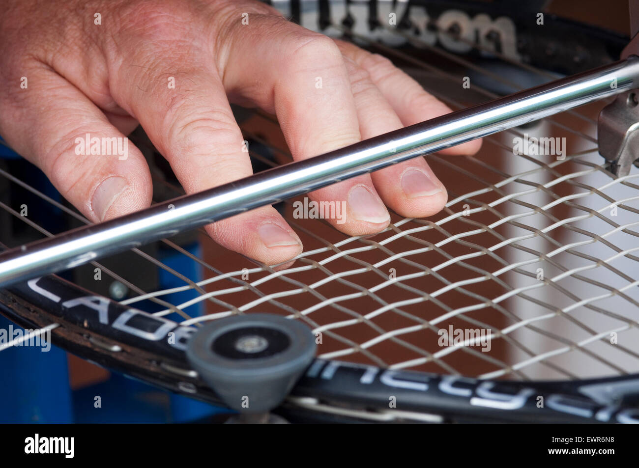Tennis Racket in Stringing Machine Being Repaired Stock Photo - Alamy