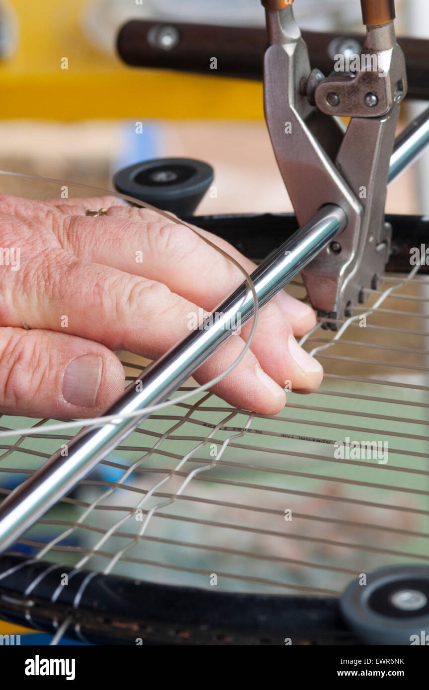 Tennis Racket in Stringing Machine Being Repaired Stock Photo - Alamy