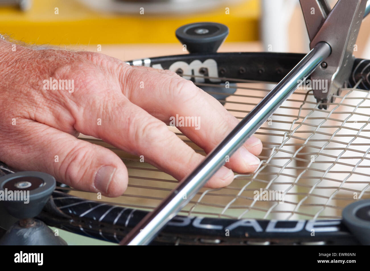 Tennis Racket in Stringing Machine Being Repaired Stock Photo - Alamy