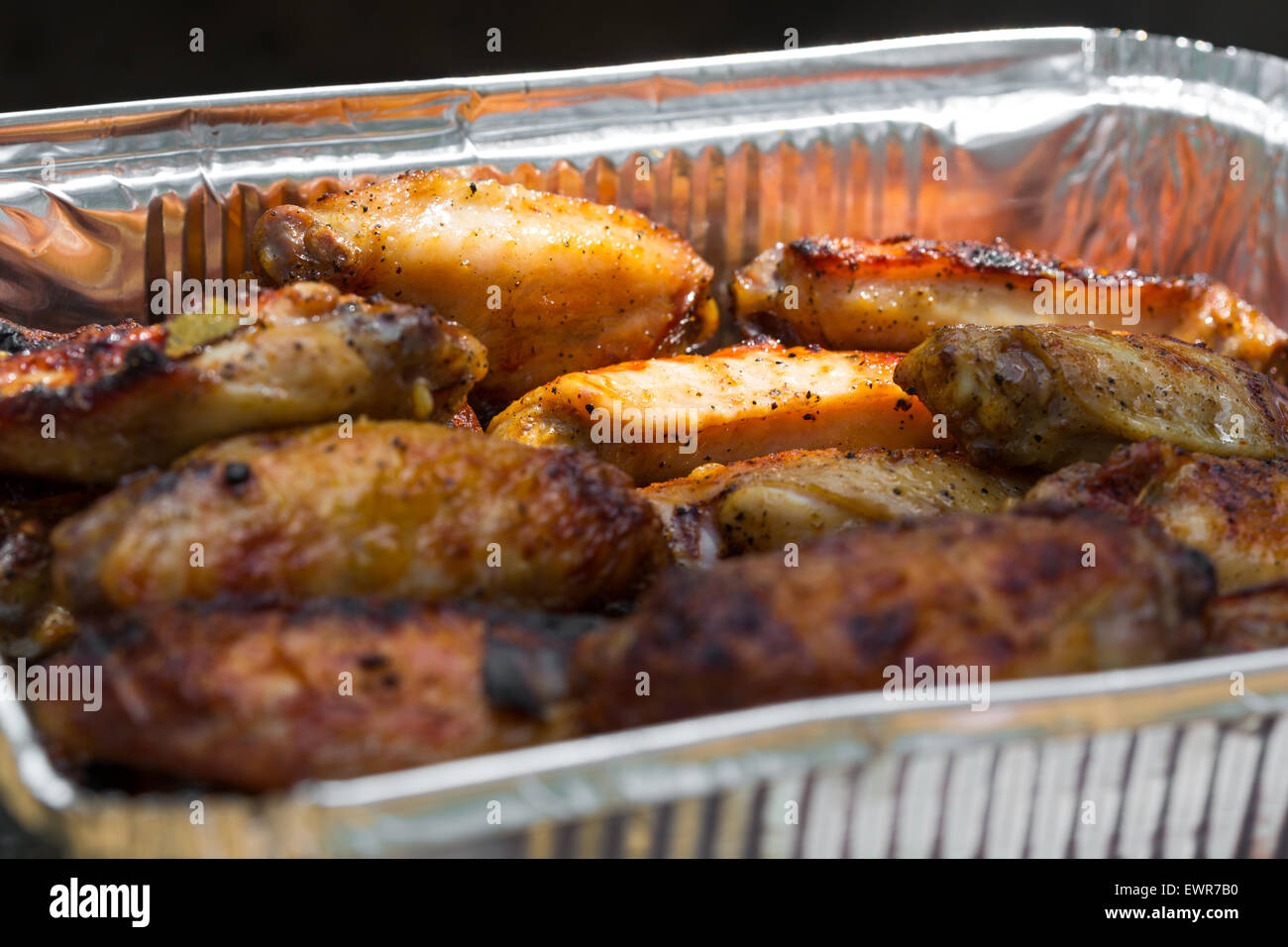 cooking grilled chicken pieces stacked in a container Stock Photo - Alamy