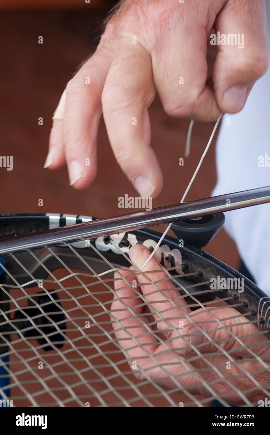 Tennis Racket in Stringing Machine Being Repaired Stock Photo - Alamy