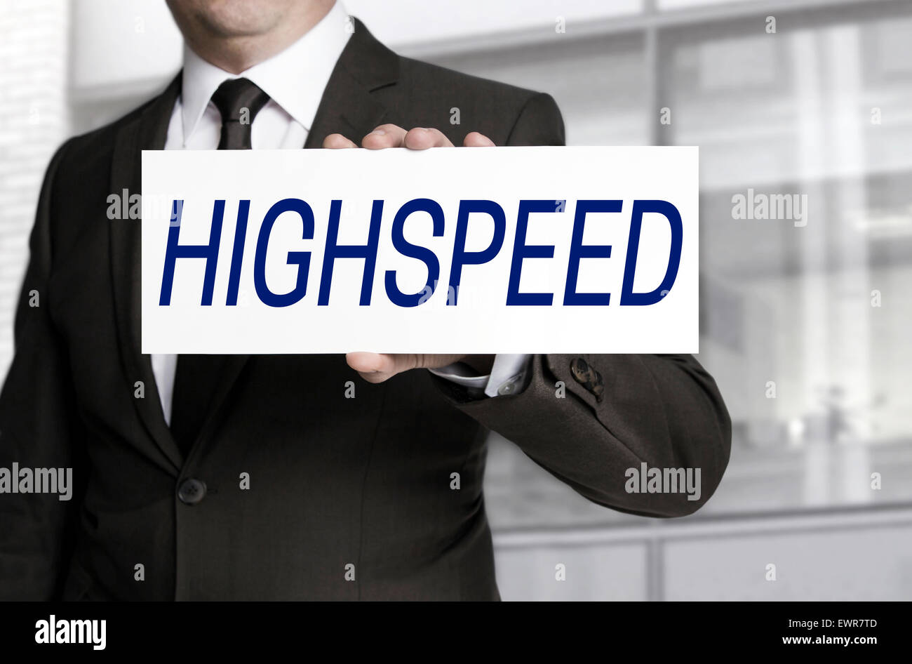 Highspeed; sign is held by businessman Stock Photo - Alamy