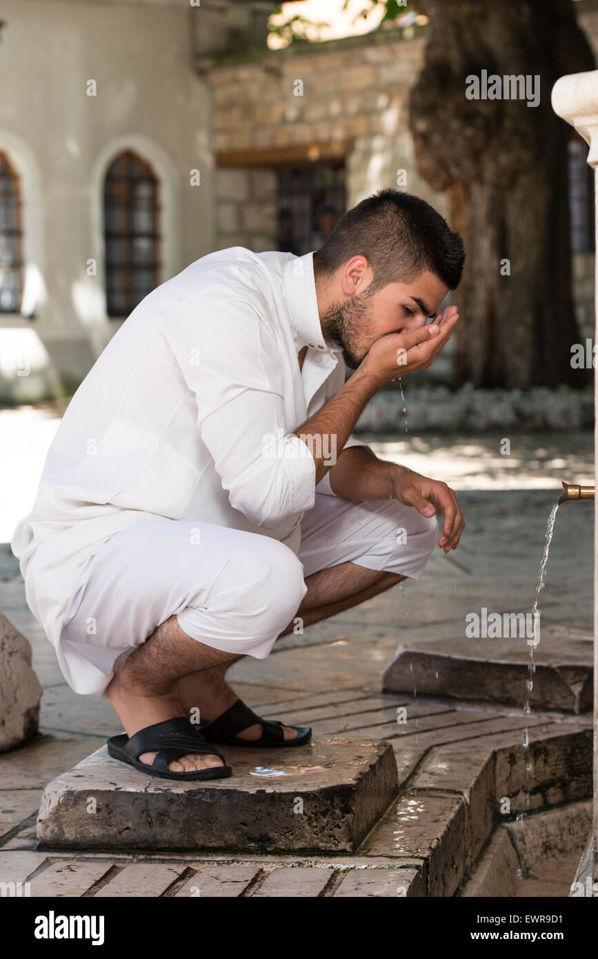 Muslim Man Preparing To Take Ablution In Mosque Stock Photo - Alamy