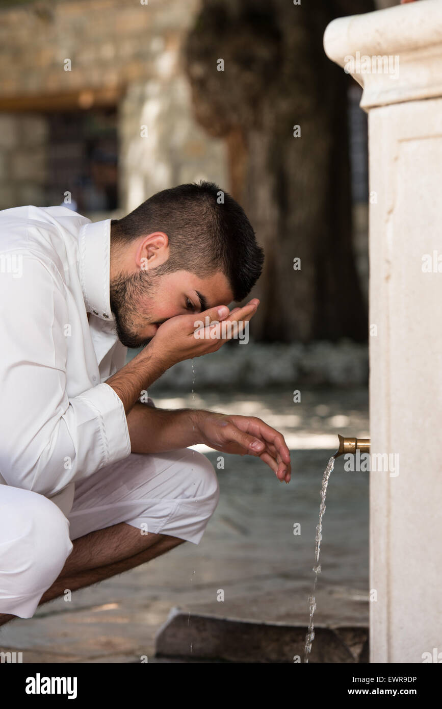 Muslim Man Preparing To Take Ablution In Mosque Stock Photo - Alamy