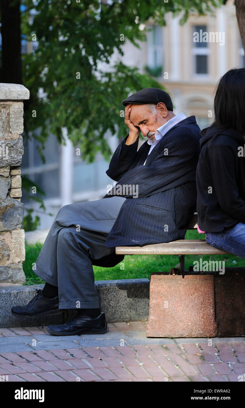Old man sleeping on a park bench Stock Photo - Alamy