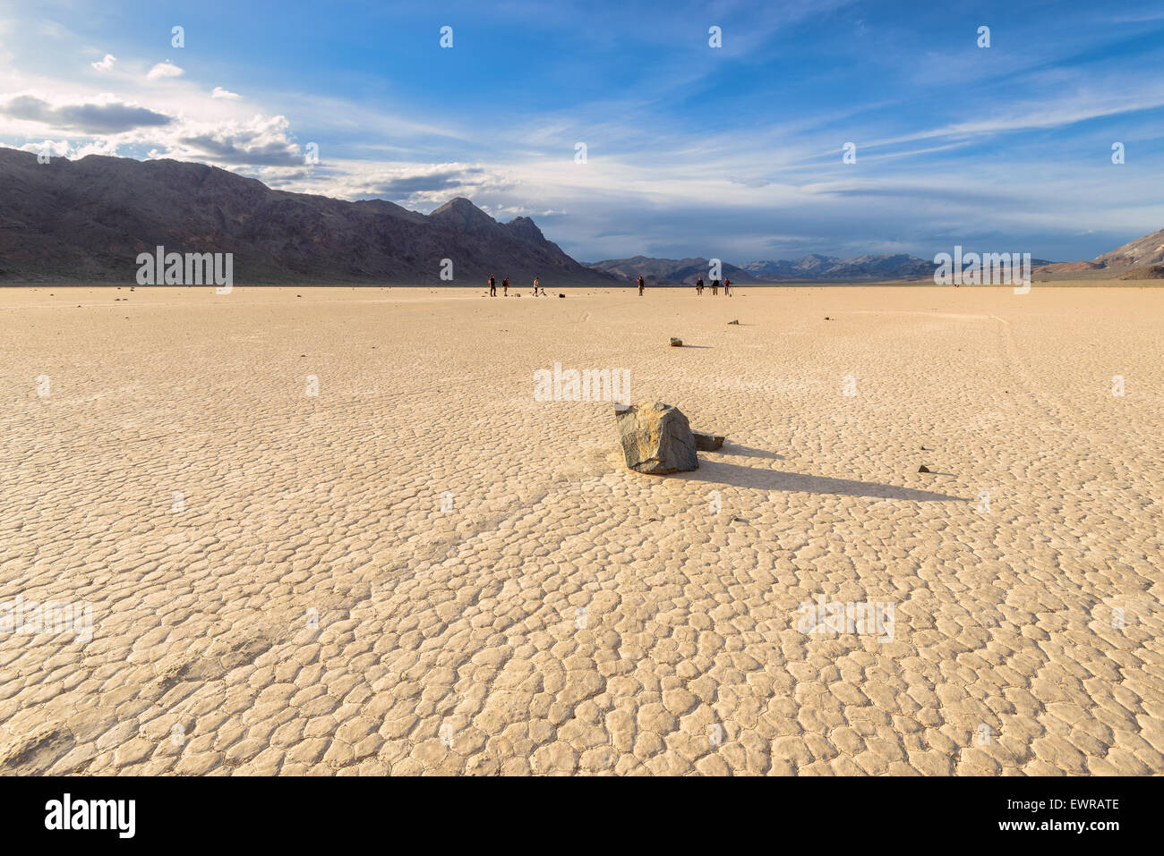 Group of photographers choose a place in the valley of moving stones ...