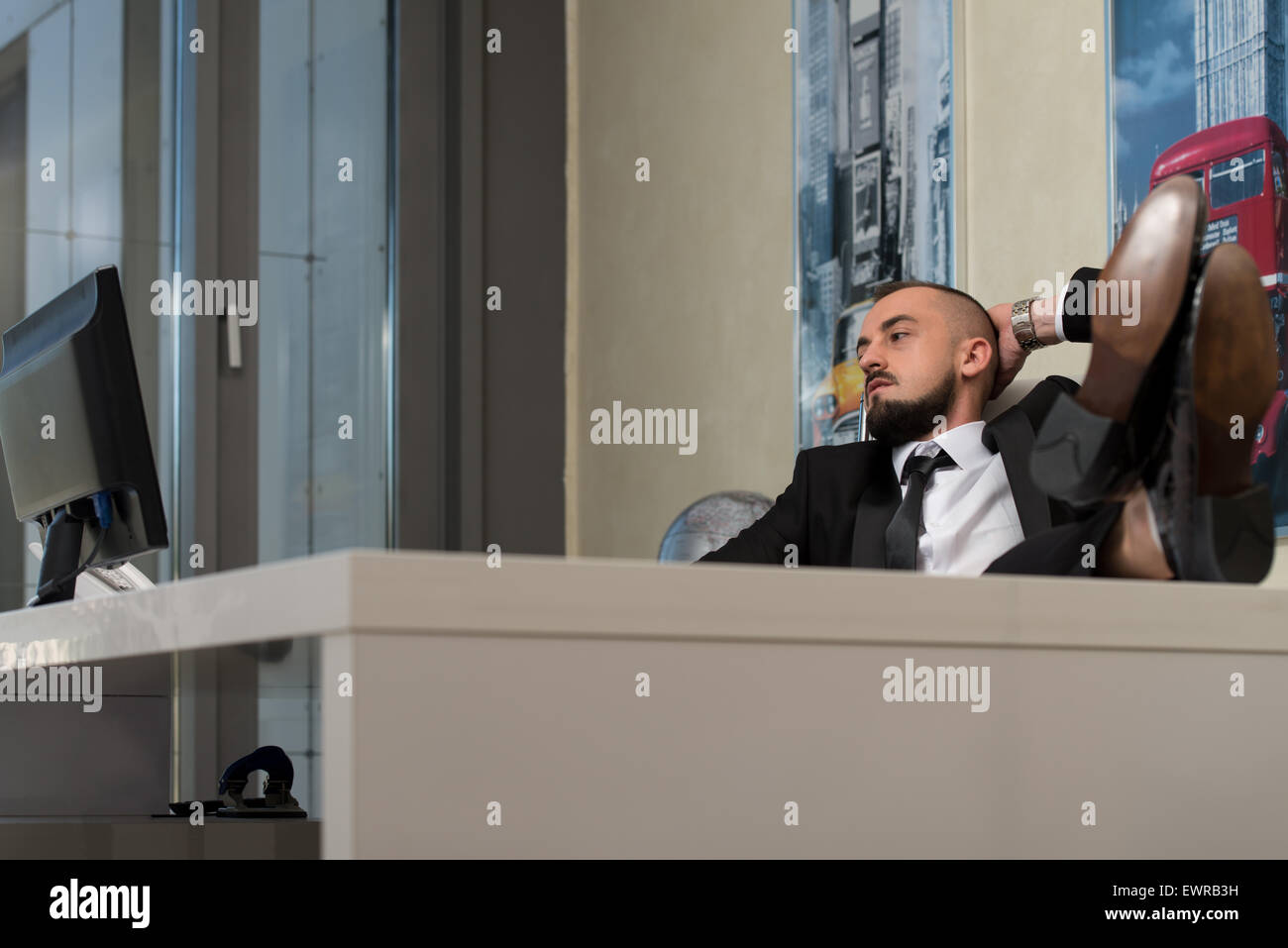 Relaxed looking man feet up hi-res stock photography and images - Alamy