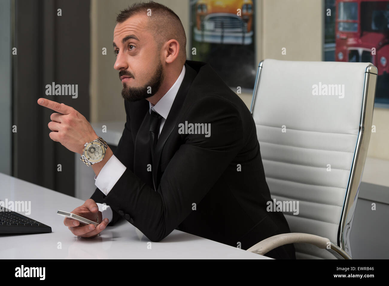 Young Businessman Is Pointing With His Finger Stock Photo - Alamy