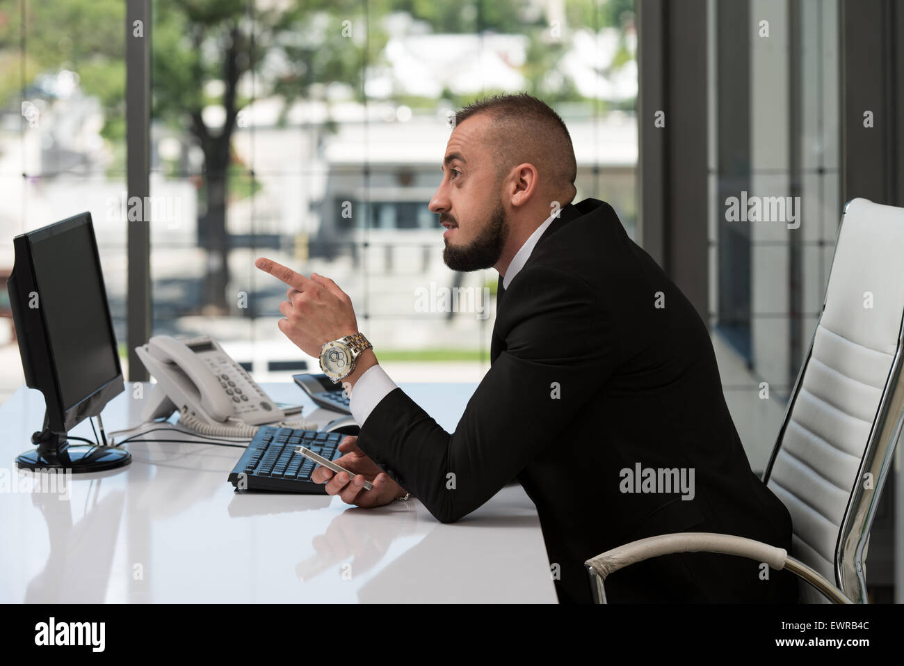 Young Businessman Is Pointing With His Finger Stock Photo - Alamy