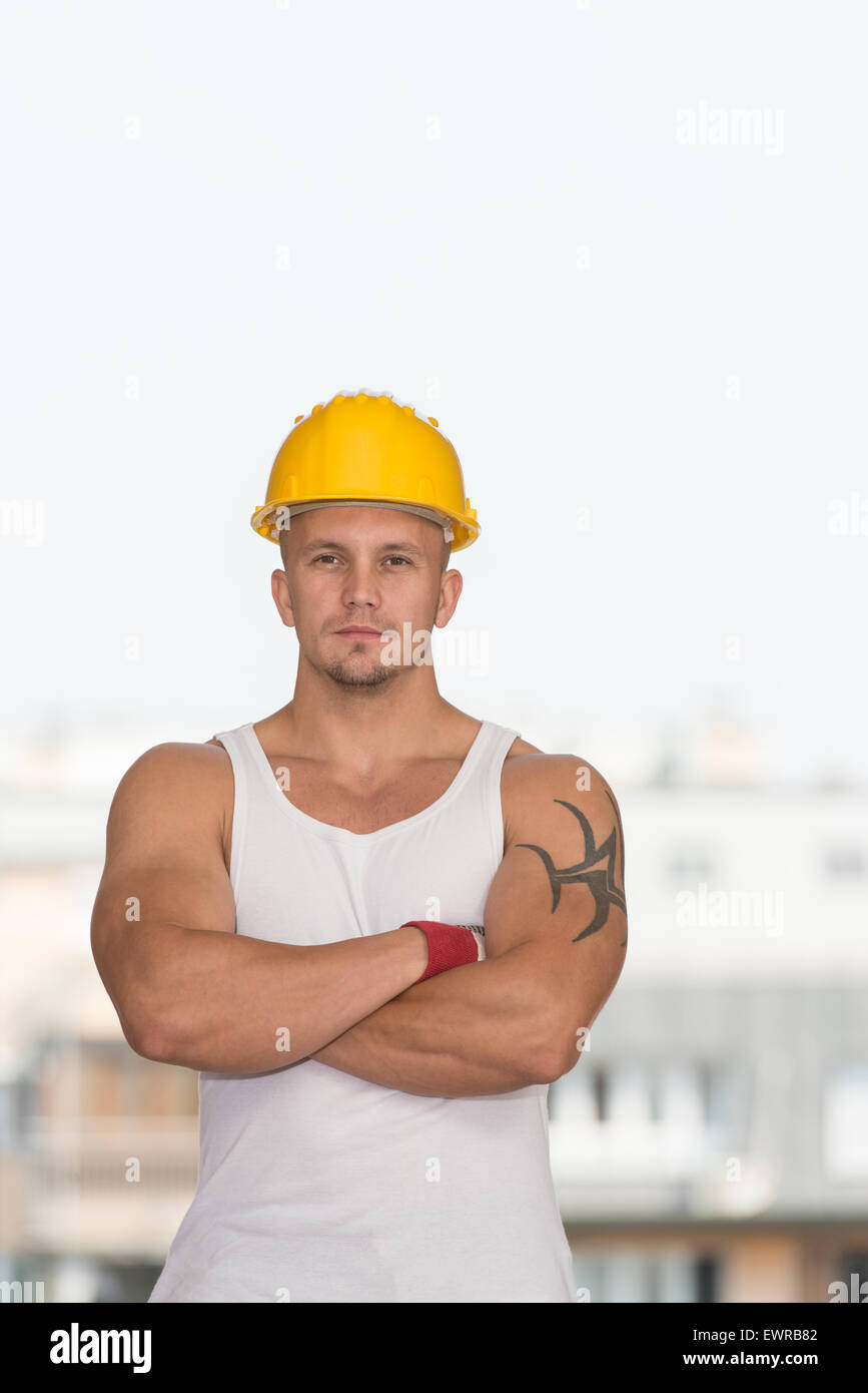 Portrait Of Handsome Engineer With Yellow Helmet Stock Photo - Alamy