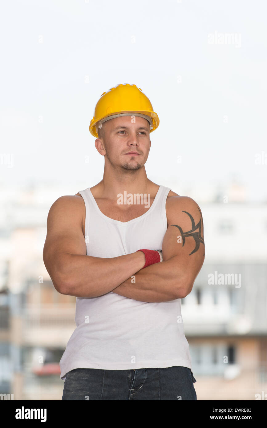 Portrait Of Handsome Engineer With Yellow Helmet Stock Photo - Alamy