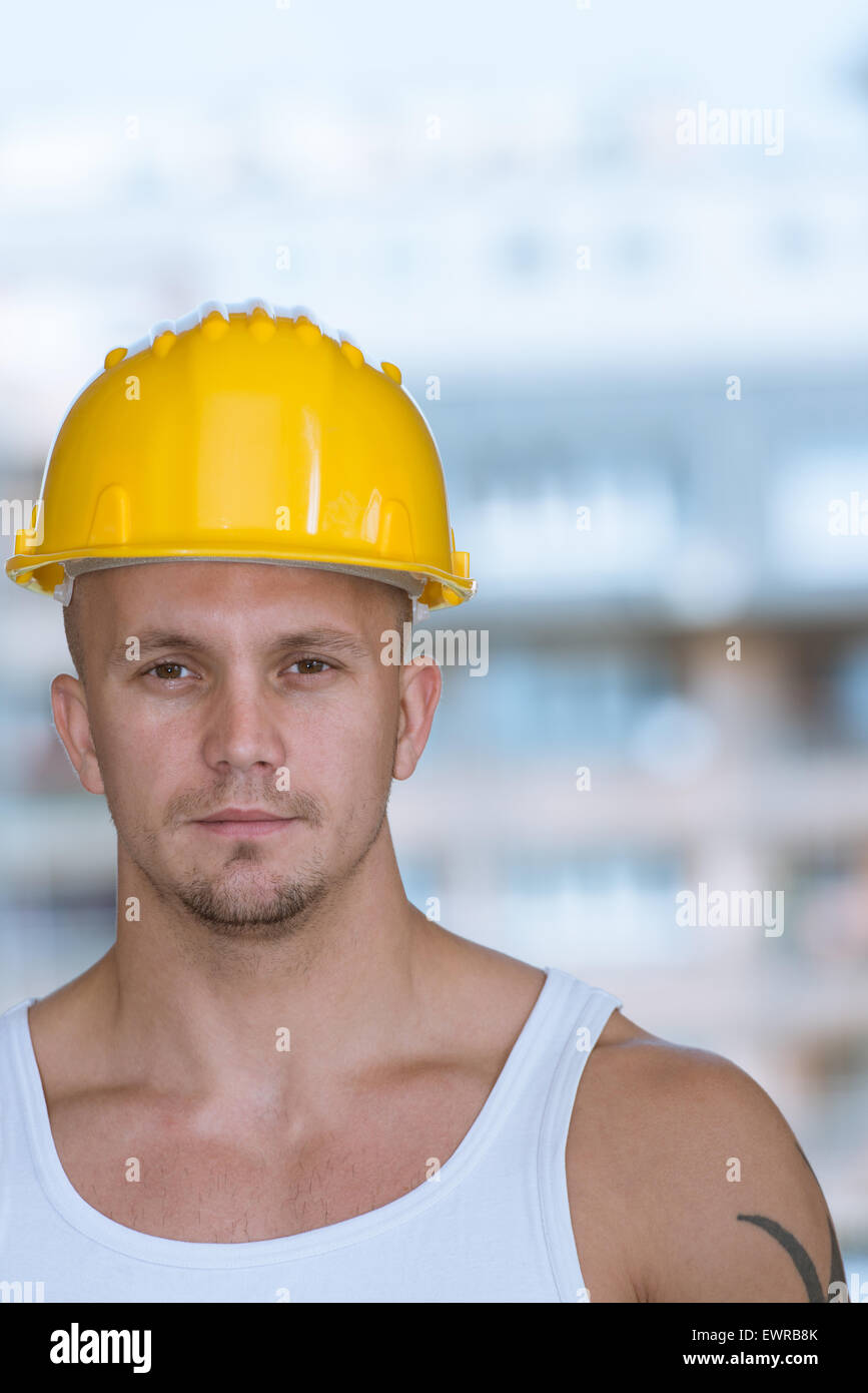 Portrait Of Handsome Engineer With Yellow Helmet Stock Photo - Alamy