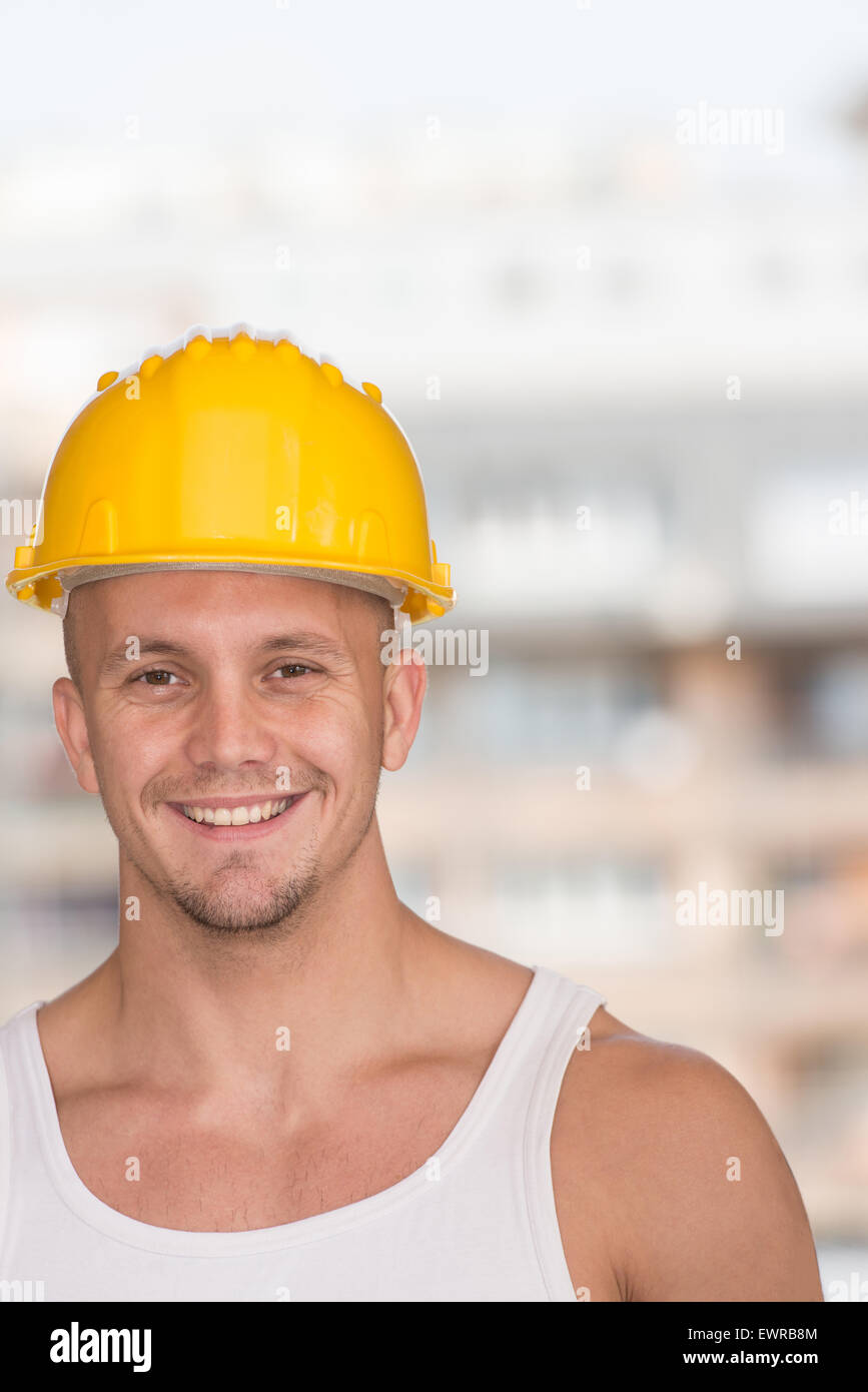 Portrait Of Handsome Engineer With Yellow Helmet Stock Photo - Alamy