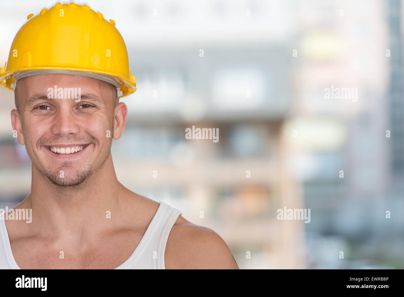 Portrait Of Handsome Engineer With Yellow Helmet Stock Photo - Alamy