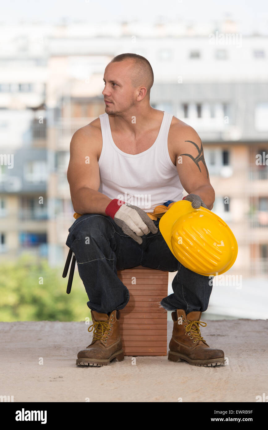 Construction Worker Relaxing The Fresh Air During Work Stock Photo - Alamy
