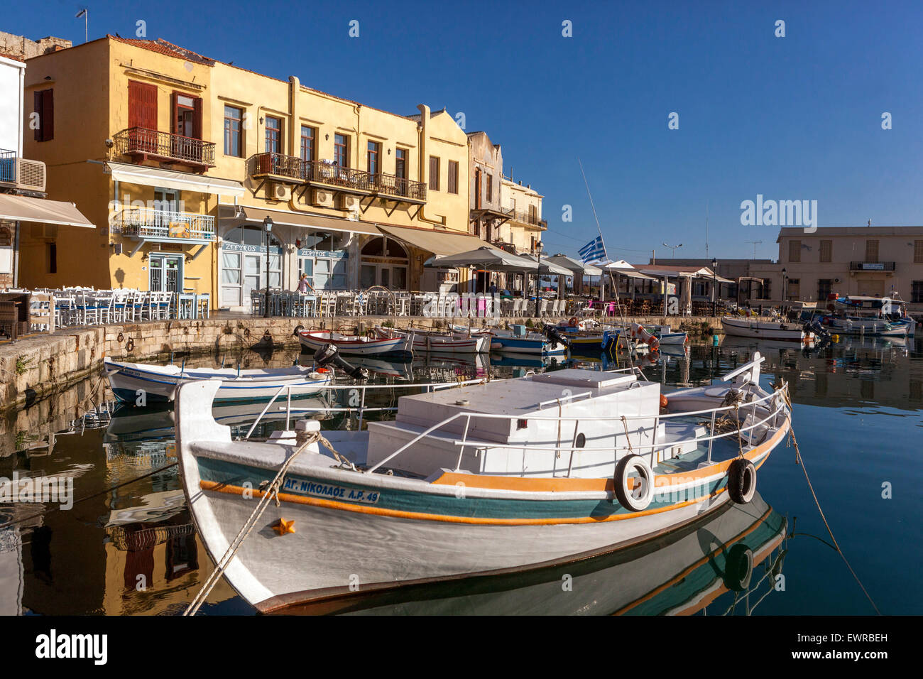 Boat anchored in the Old Venetian harbour, Rethymno Crete harbour ...