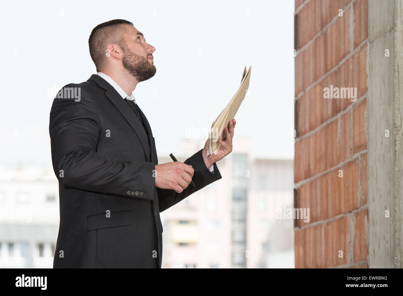 Portrait Of Construction Master With Blueprint In Hands Stock Photo - Alamy