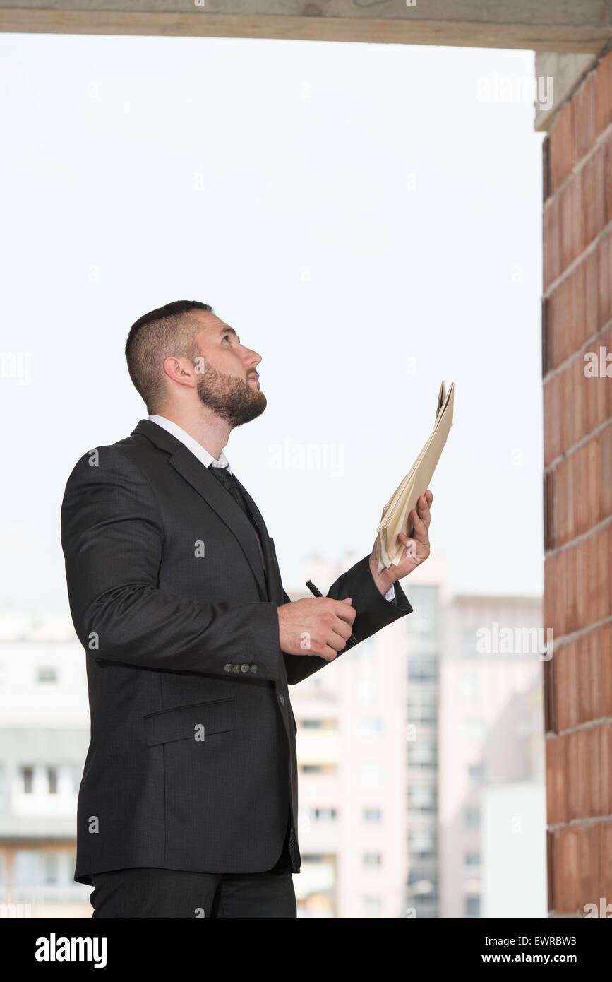 Portrait Of Construction Master With Blueprint In Hands Stock Photo - Alamy