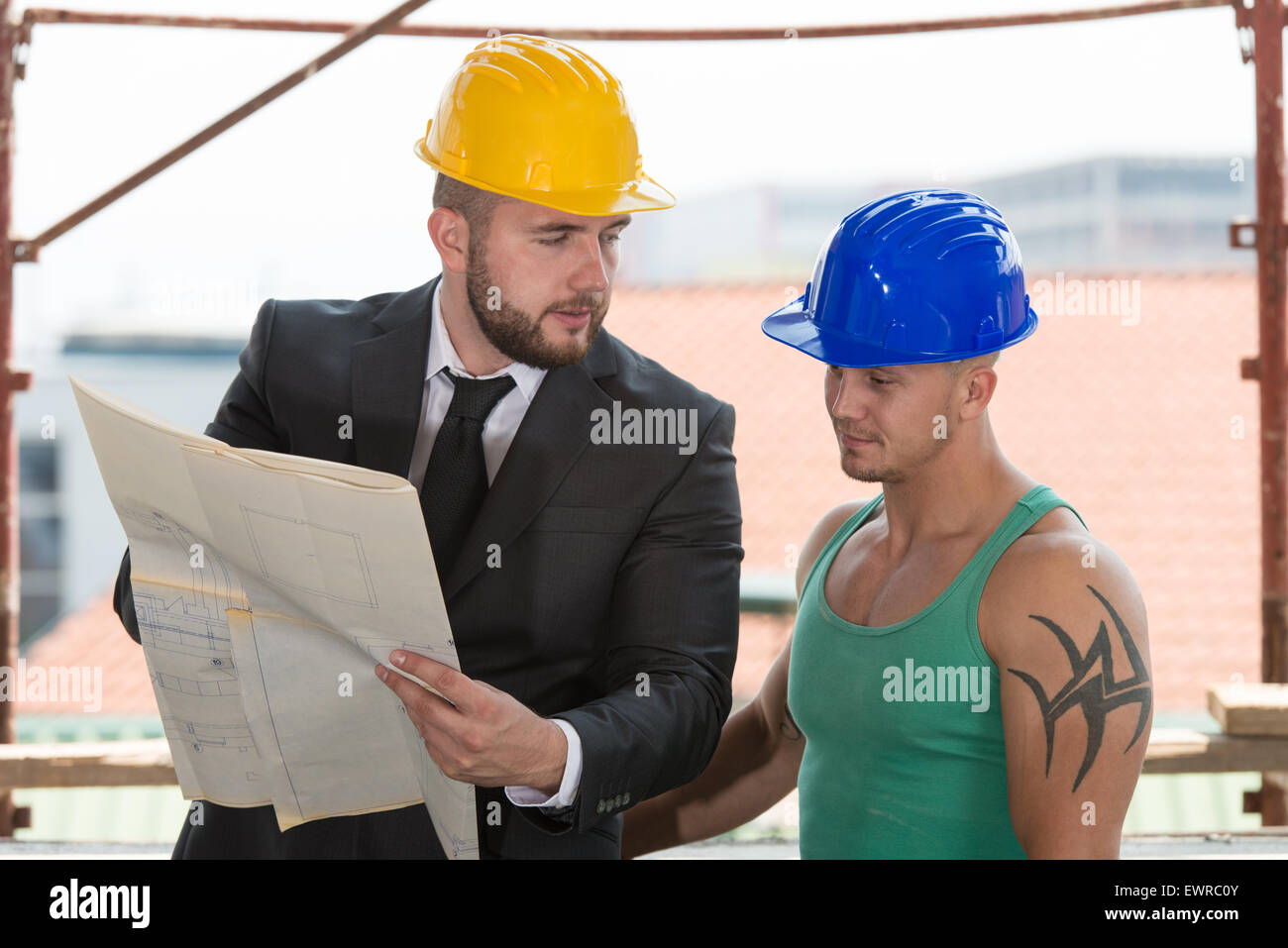 Group Of Male Architect And Construction Worker On Construction Site ...