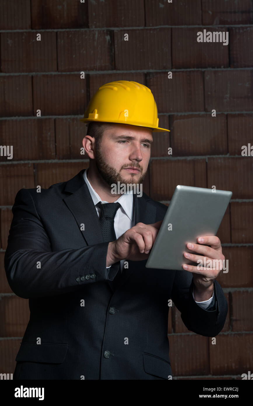 Portrait Of Construction Master With Personal Computer In Hands Stock ...