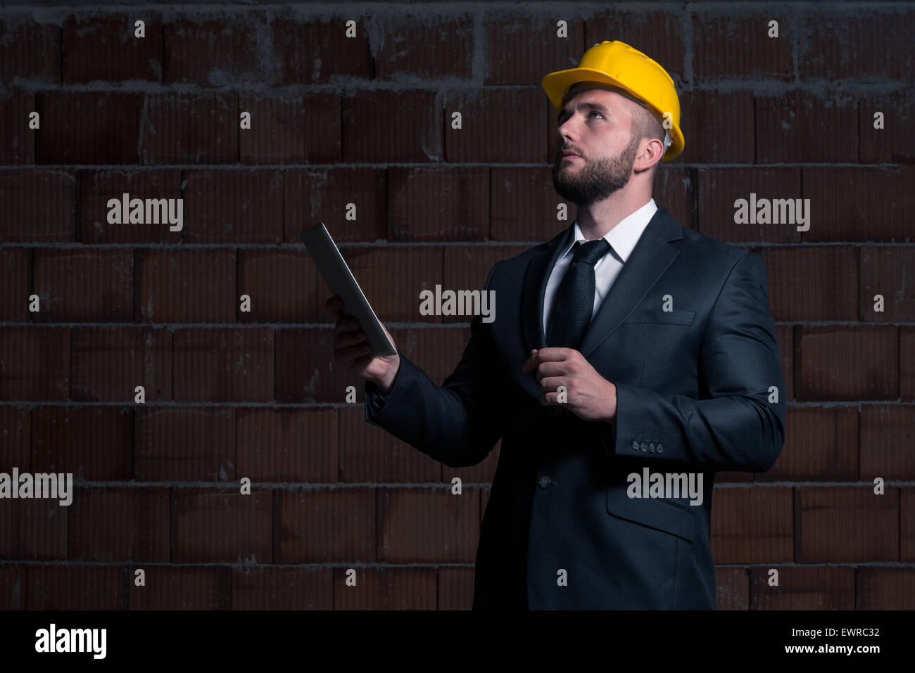 Portrait Of Construction Master With Personal Computer In Hands Stock ...
