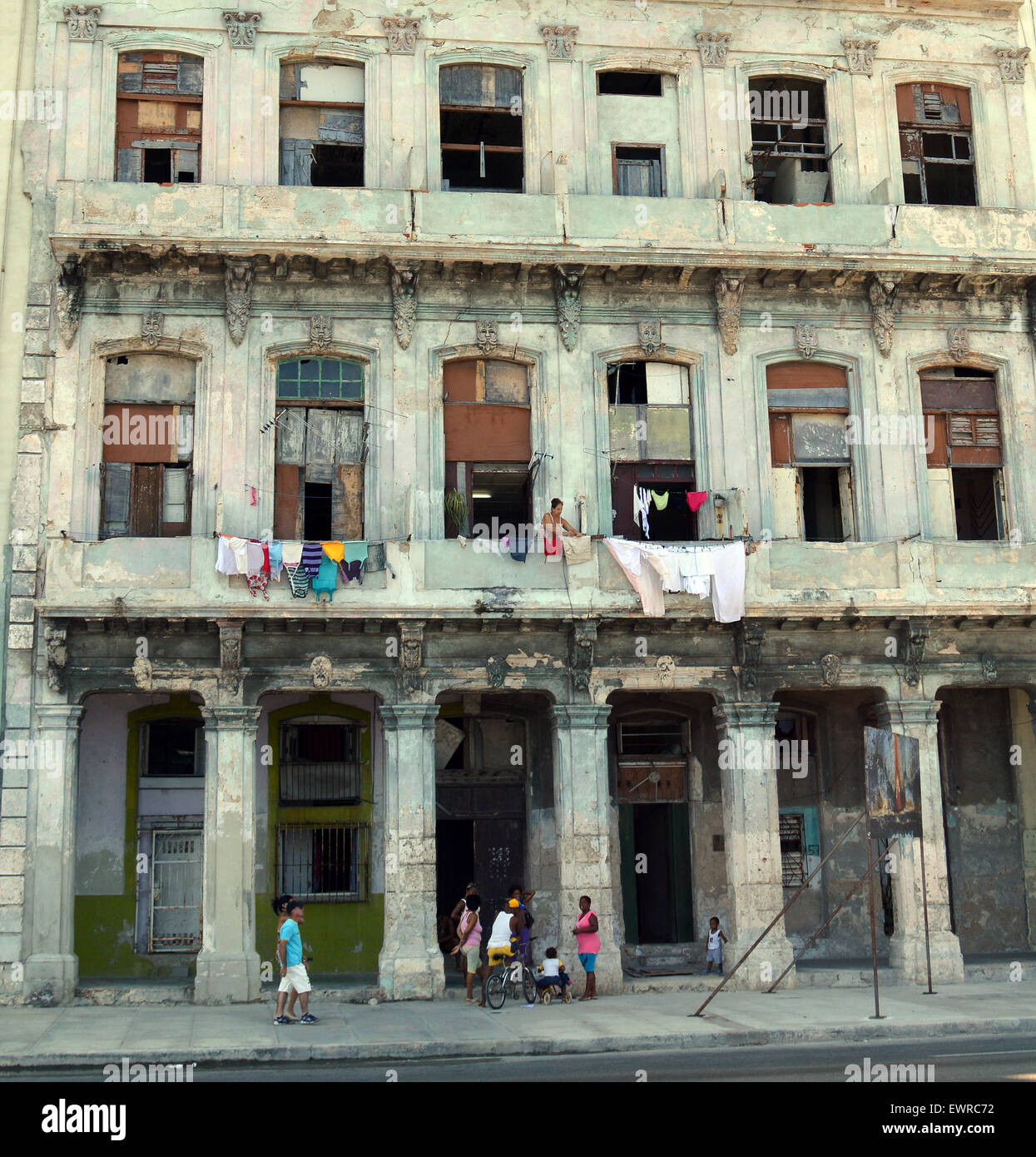 Havana, Cuba: Hanging washing and chatting outside apartment block on ...
