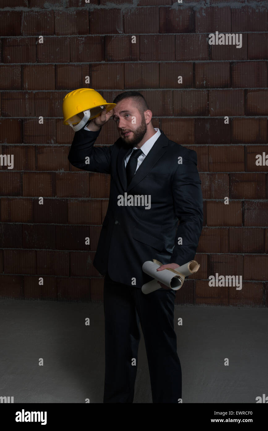 Engineer in helmet blueprint blueprints hi-res stock photography and ...