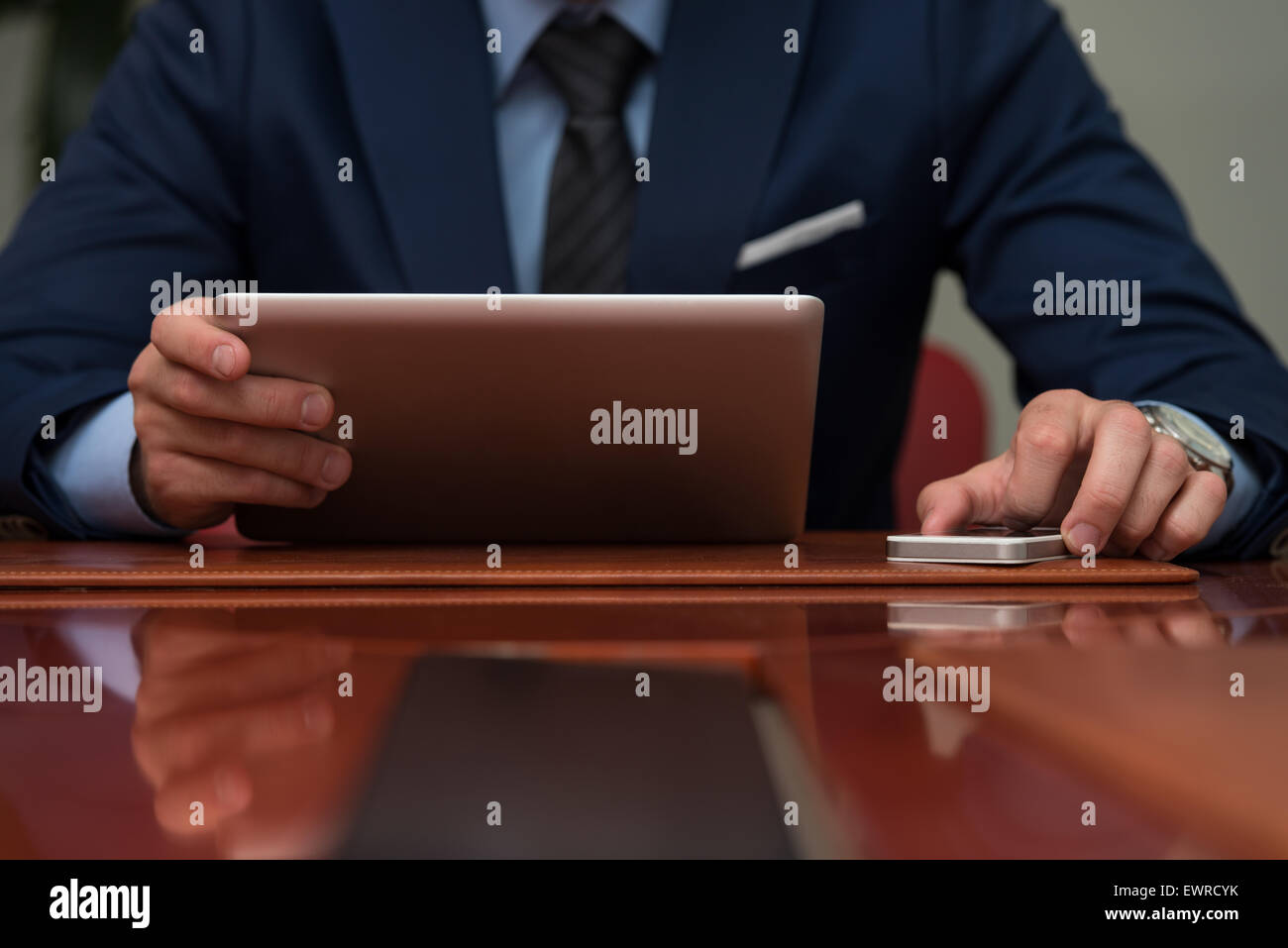 Young Businessmen Using Touchpad At Meeting Stock Photo - Alamy