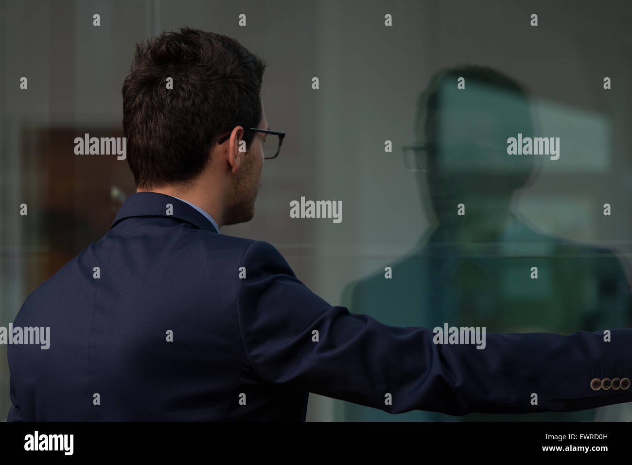 Rear View Of Young Businessman In Office Stock Photo - Alamy