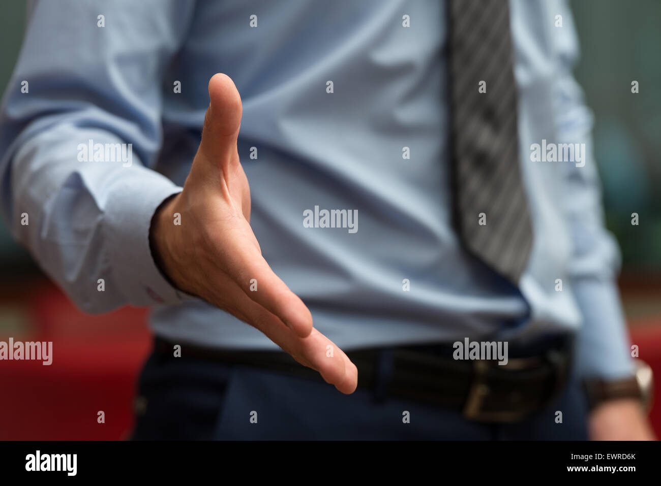Business man extending hand shake hi-res stock photography and images ...