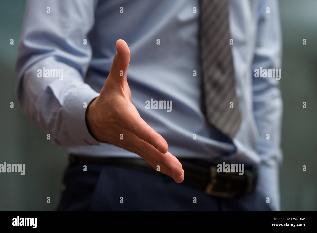Business man extending hand shake hi-res stock photography and images - Alamy