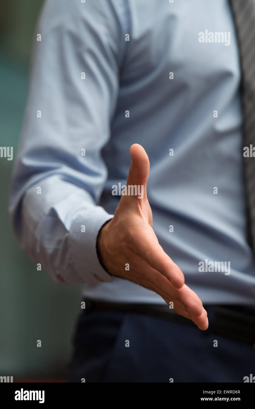 Business man extending hand shake hi-res stock photography and images - Alamy