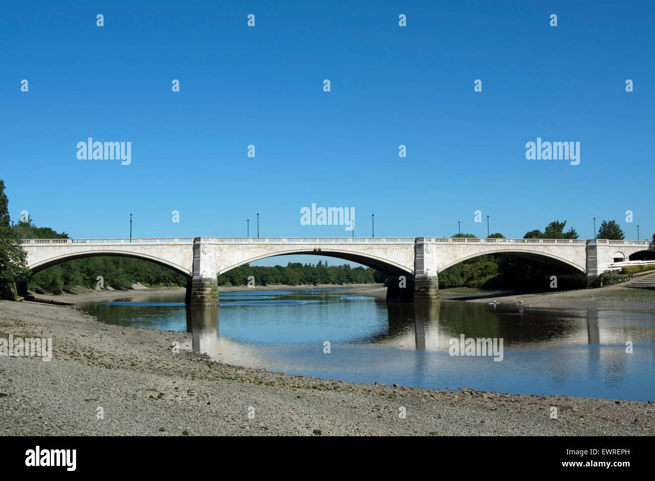 chiswick bridge, crossing the river thames, seen at low tide from ...