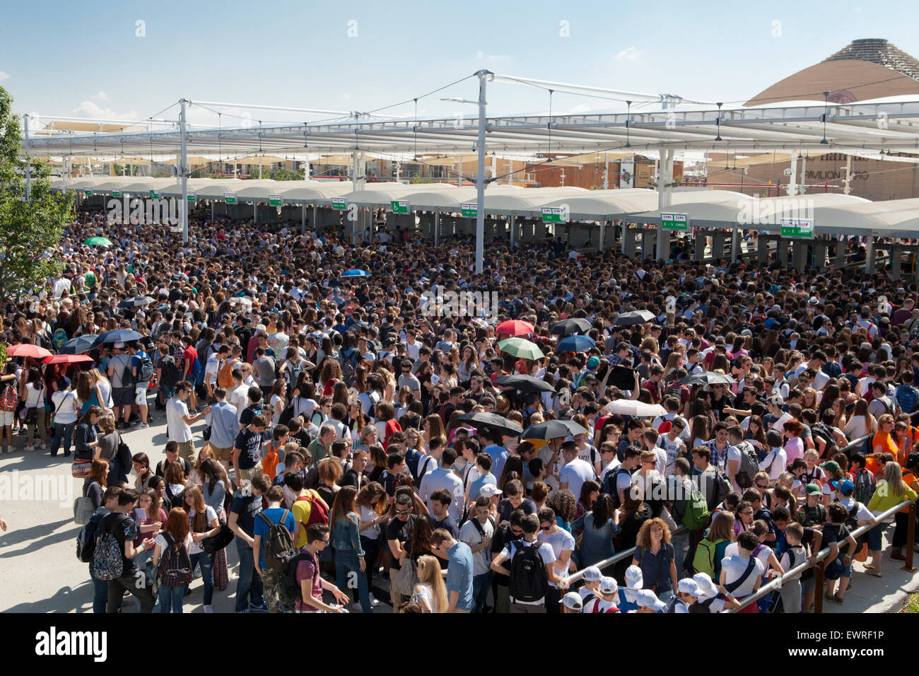 People lining up at the Expo 2015 gates on first days of it's opening ...