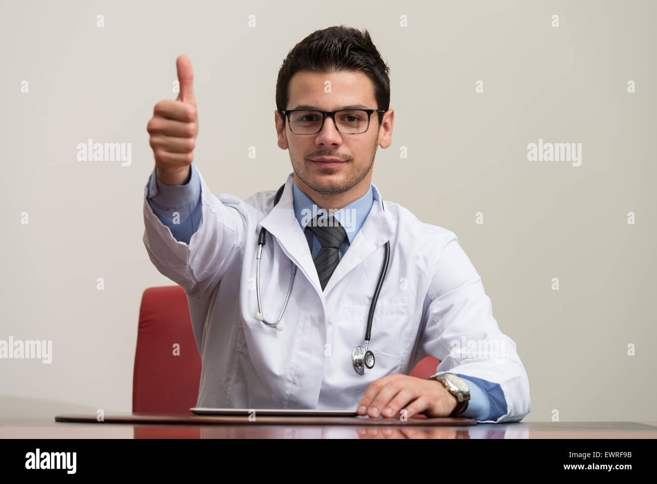 Happy Smiling Cheerful Doctor With Thumbs Up Gesture Stock Photo - Alamy