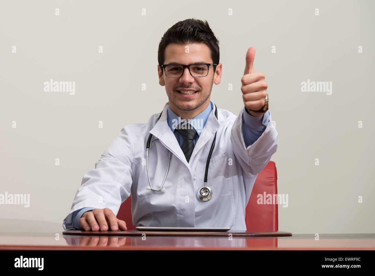 Happy Smiling Cheerful Doctor With Thumbs Up Gesture Stock Photo - Alamy