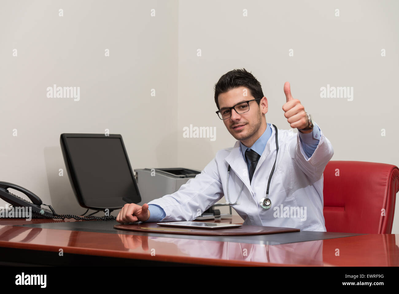 Happy Smiling Cheerful Doctor With Thumbs Up Gesture Stock Photo - Alamy