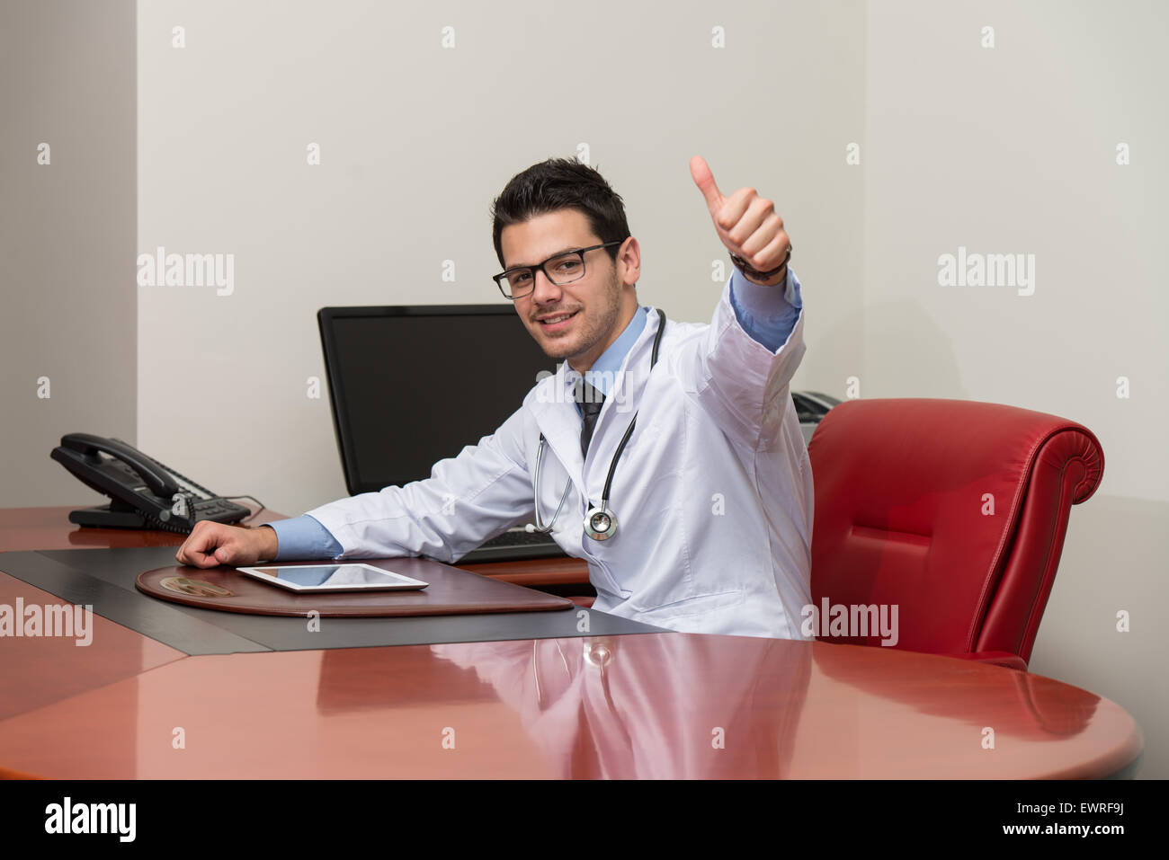 Happy Smiling Cheerful Doctor With Thumbs Up Gesture Stock Photo - Alamy