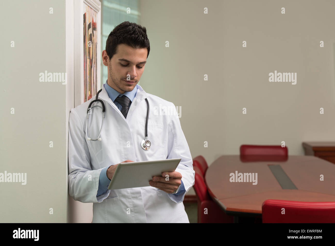 Handsome Doctor Looking At His Computer Monitor In His Office Stock ...
