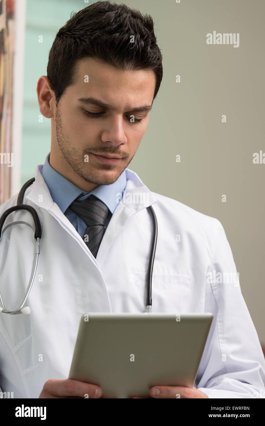 Handsome Doctor Looking At His Computer Monitor In His Office Stock ...