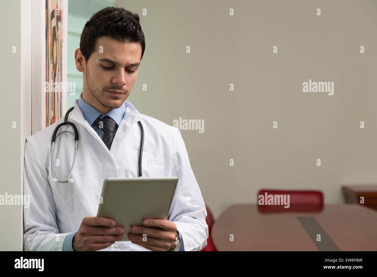 Handsome Doctor Looking At His Computer Monitor In His Office Stock ...