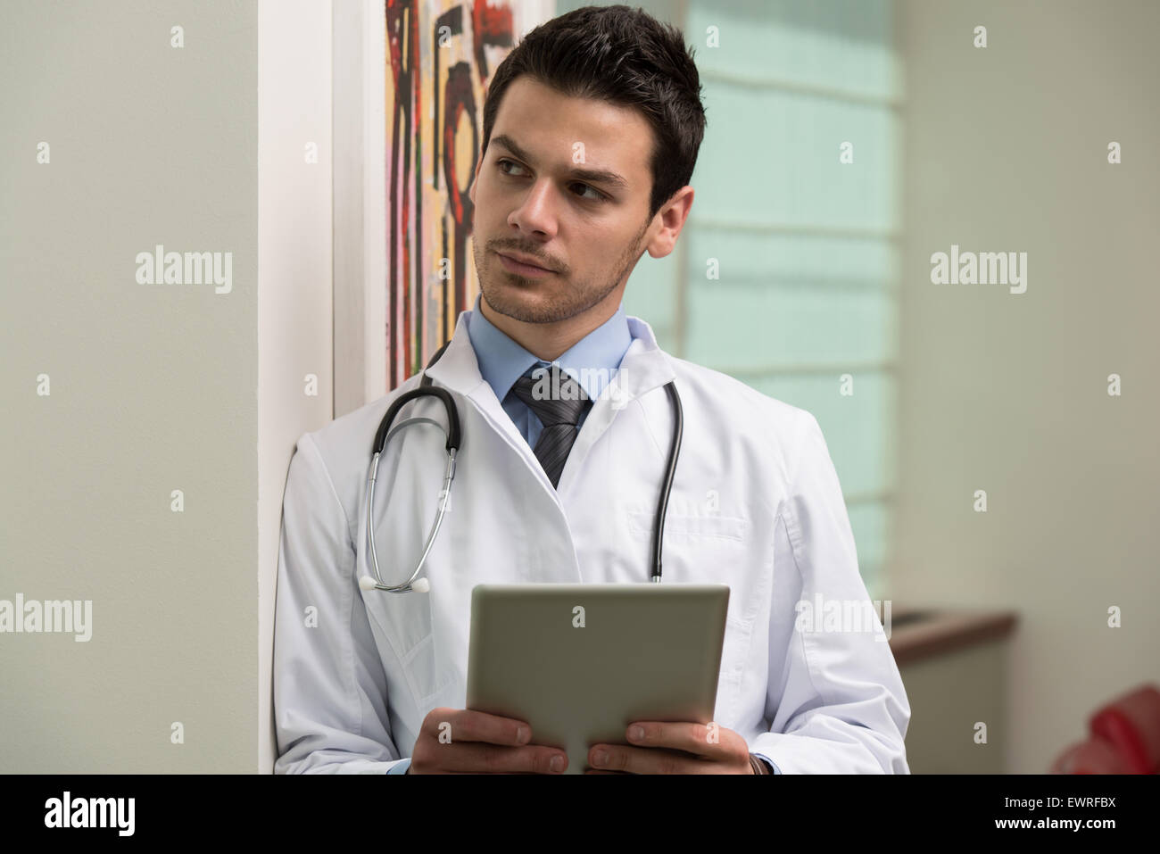 Handsome Doctor Looking At His Computer Monitor In His Office Stock ...
