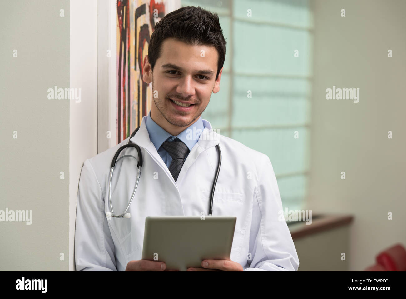 Handsome Doctor Looking At His Computer Monitor In His Office Stock ...