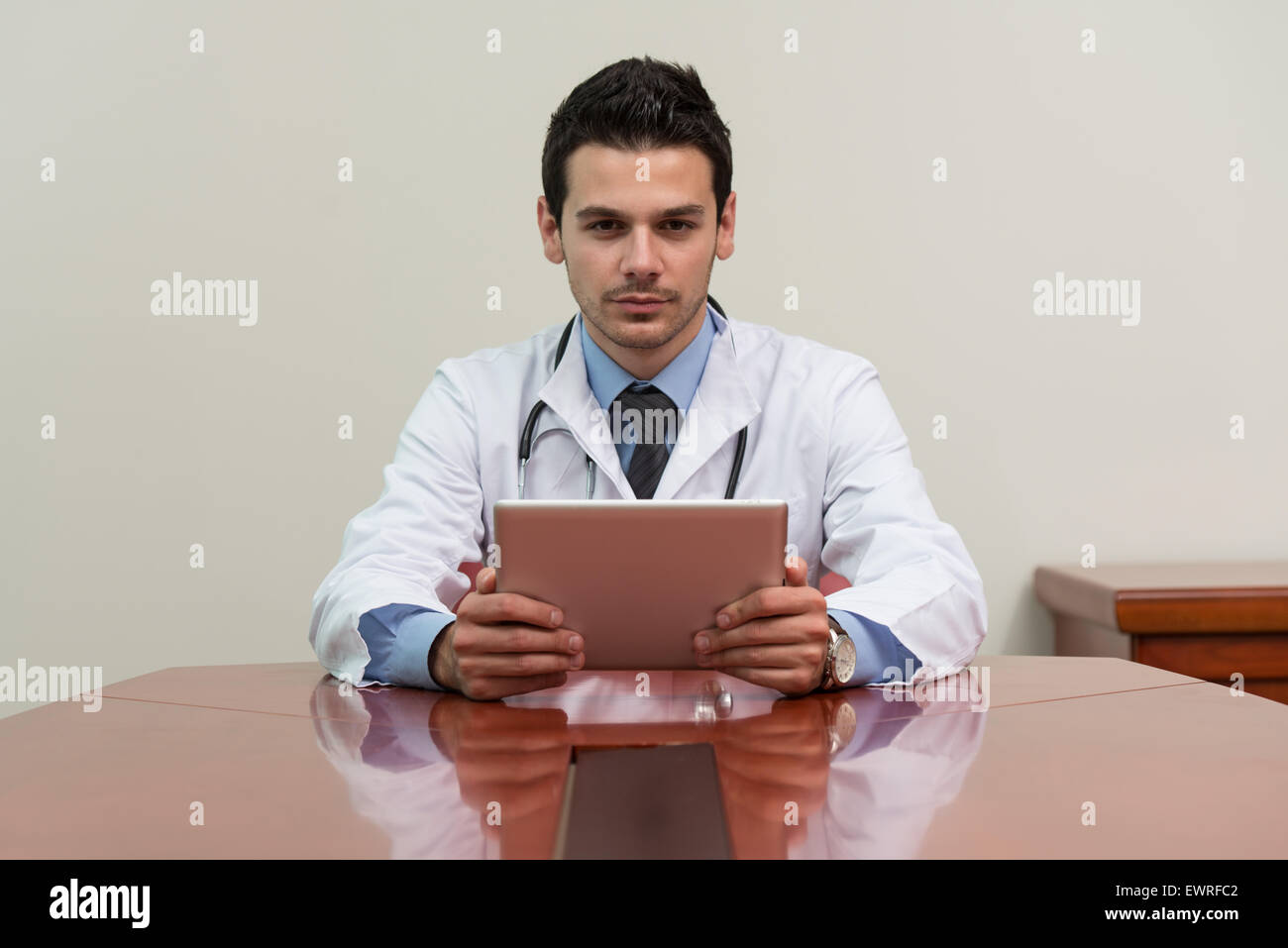 Handsome Doctor Looking At His Computer Monitor In His Office Stock ...